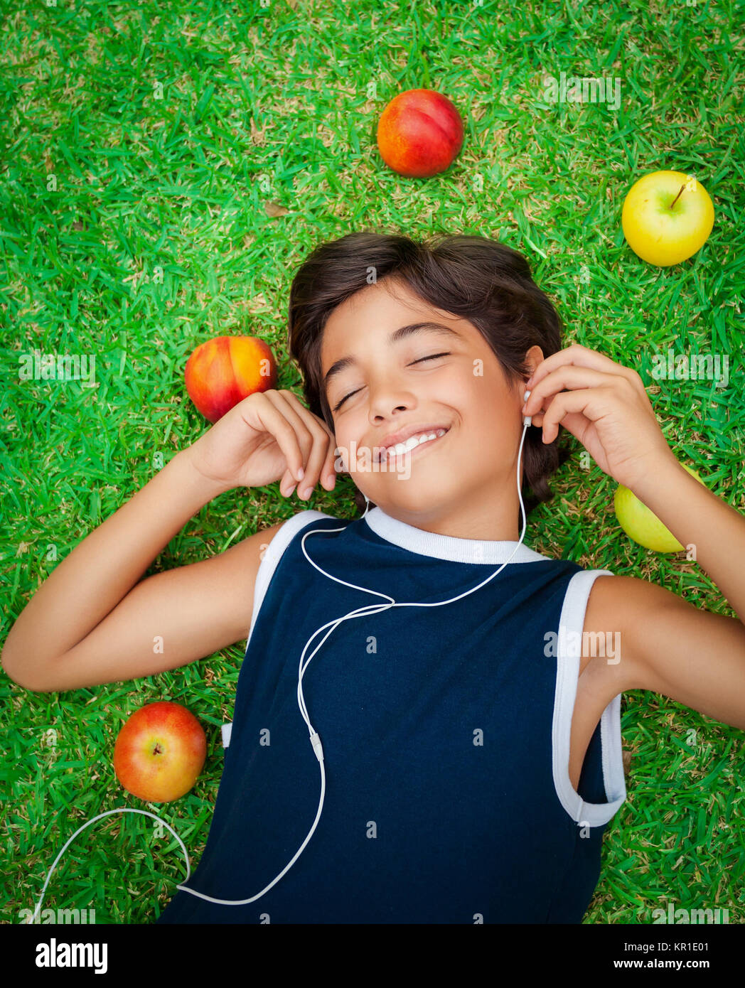 Happy schoolboy listening music hi-res stock photography and images - Alamy