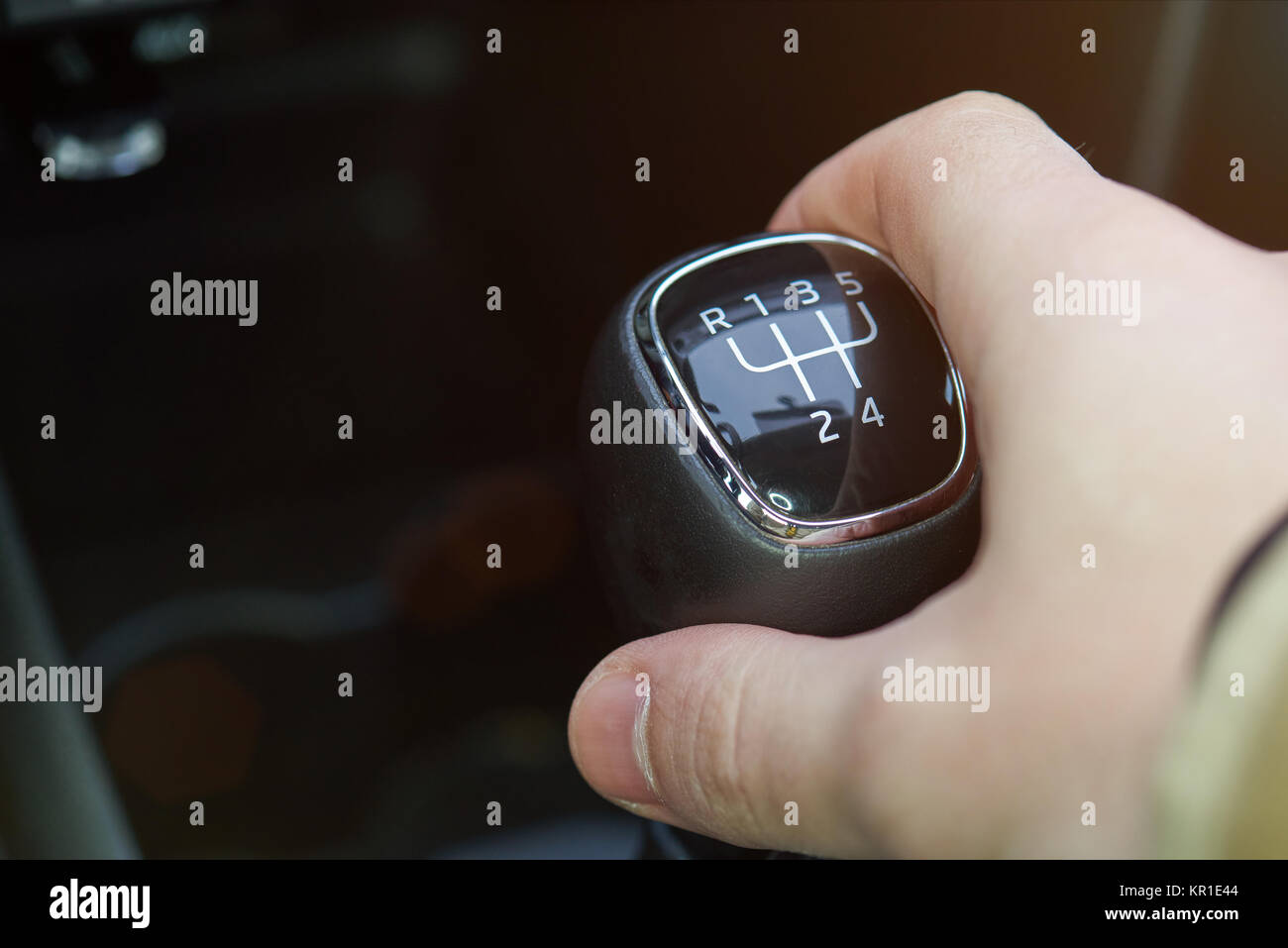 Close up of manual gear stick in hand. Changing gear theme Stock Photo ...