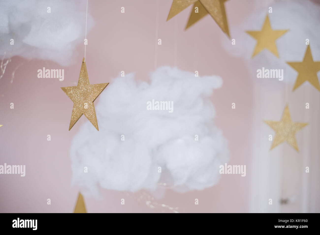 Cotton wadding clouds with stars on pink background Stock Photo - Alamy