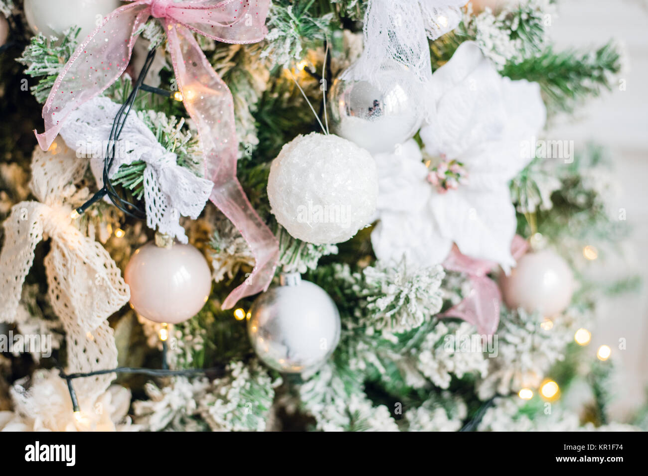 Embellished Christmas tree decoration white flower Stock Photo - Alamy