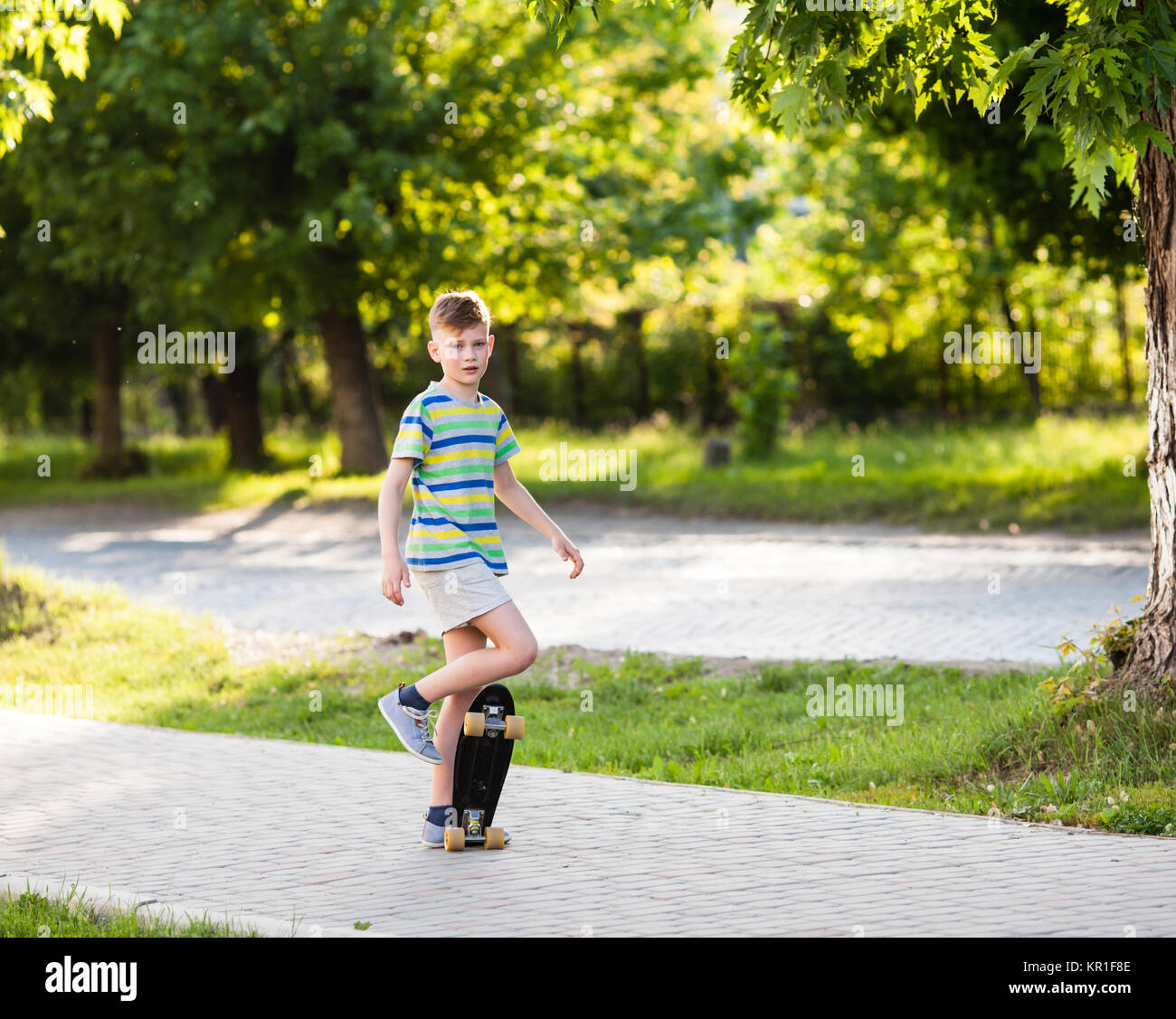 Boy riding a skateboard Stock Photo - Alamy