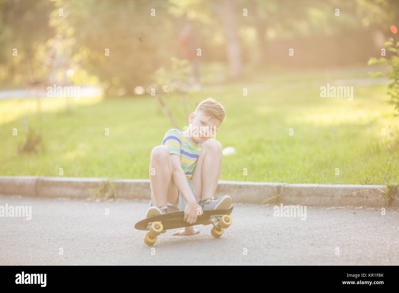 Boy riding a skateboard Stock Photo - Alamy
