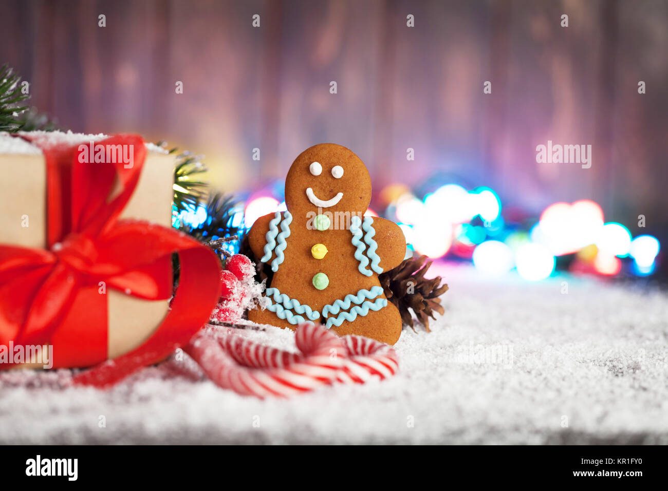Christmas gift box, candy canes, gingerbread man and snow fir tree ...
