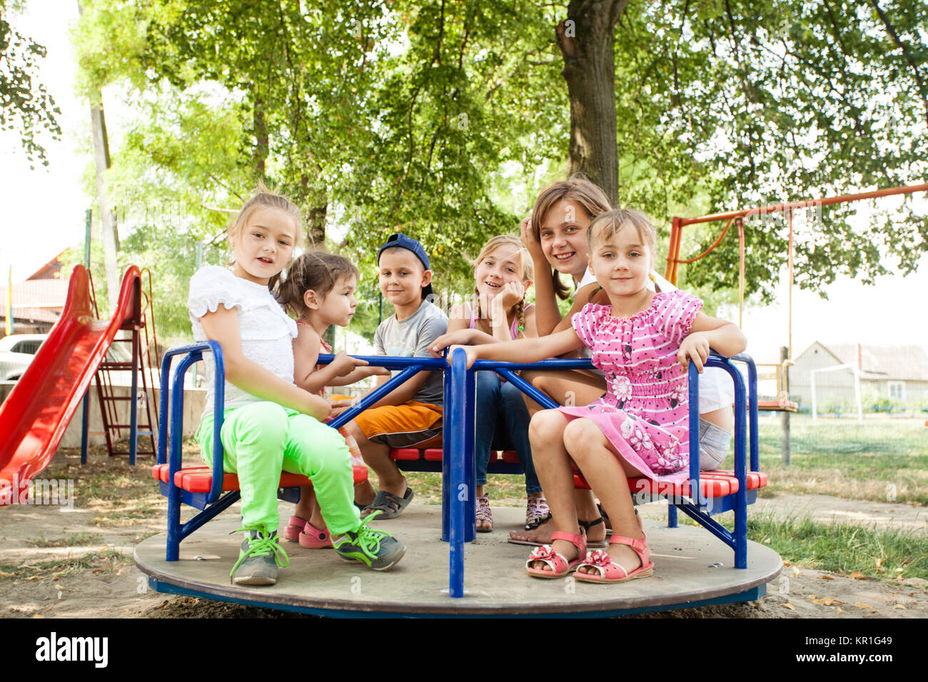 Kids on the carousel Stock Photo - Alamy