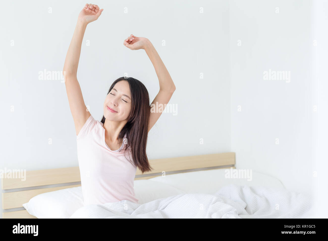 Woman raising up hand at morning Stock Photo - Alamy