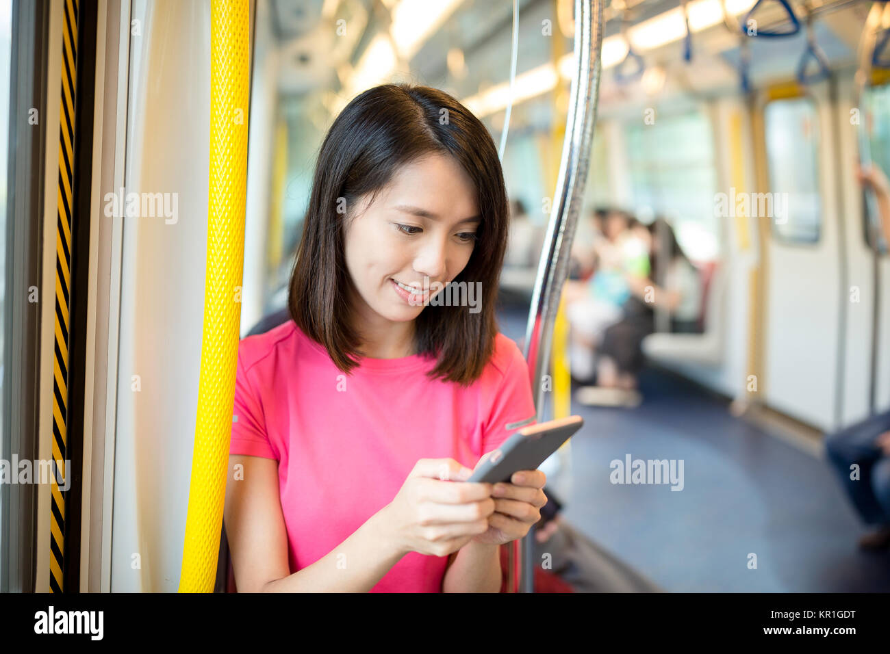 Woman use of cell phone inside train compartment Stock Photo - Alamy