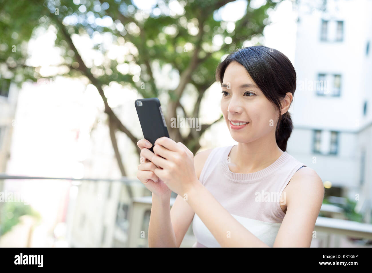 Asian Woman use of phone Stock Photo - Alamy