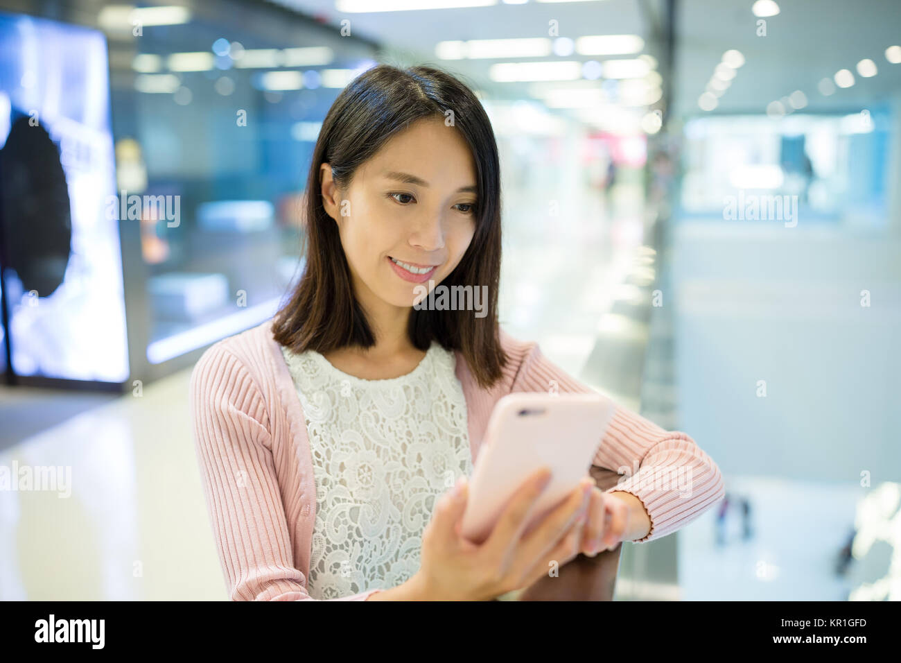 Asian Woman use of cellphone Stock Photo - Alamy