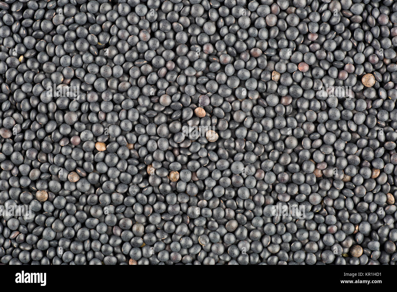Black lentils texture Stock Photo - Alamy