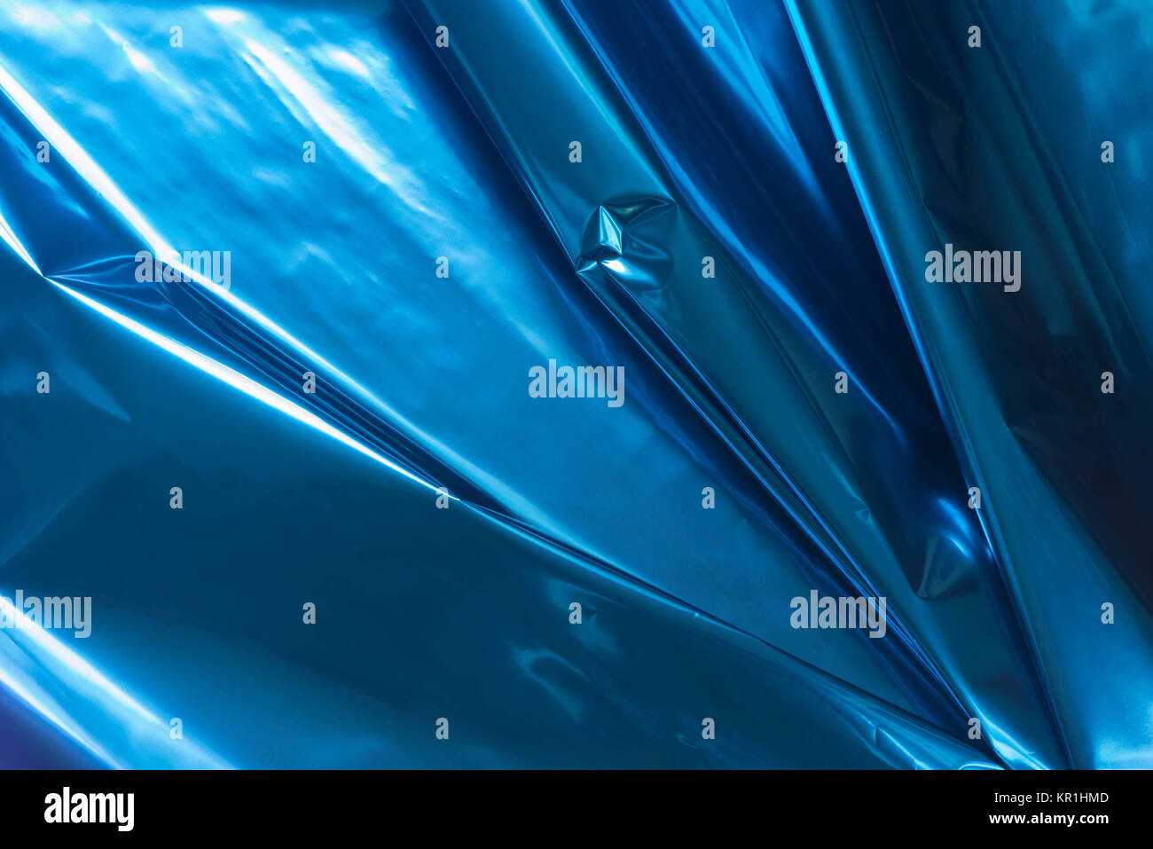 blue color folded metallic foil abstract bacgkground Stock Photo - Alamy