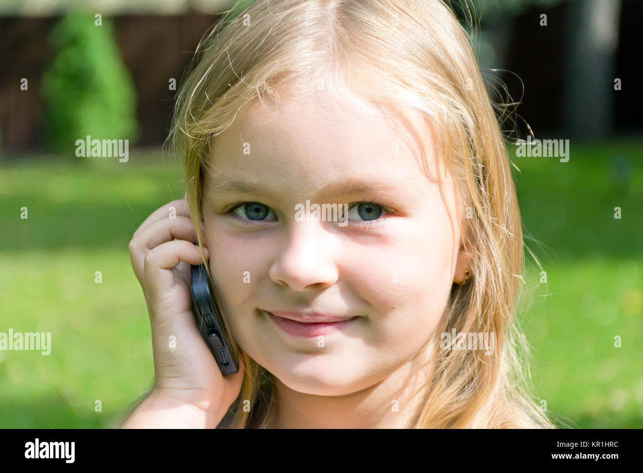 Cute girl talking by cellular Stock Photo - Alamy