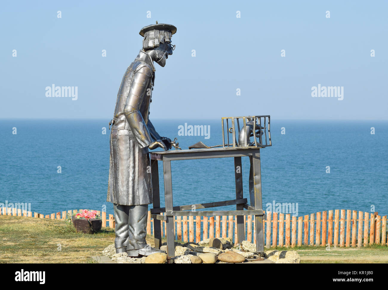 Statue of a furrier from metal with a rat in a cage Stock Photo - Alamy
