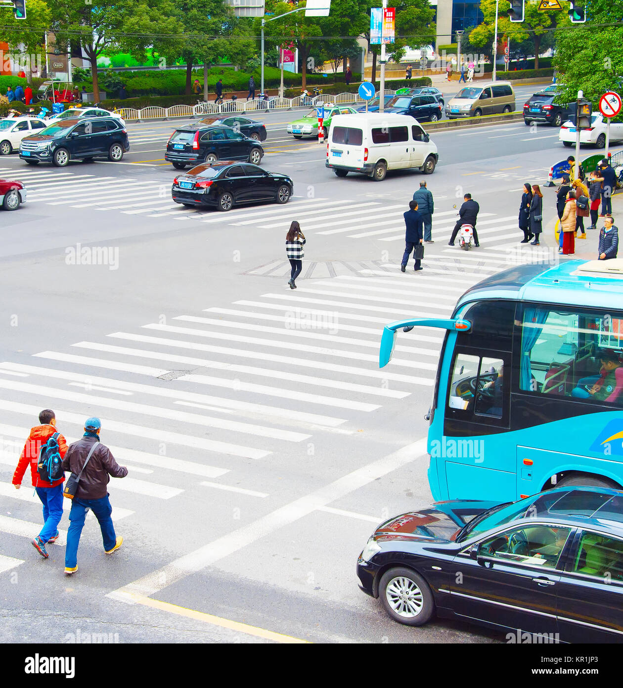 SHANGHAI, CHINA - DEC 28, 2016: People crossing the crosswalk at ...