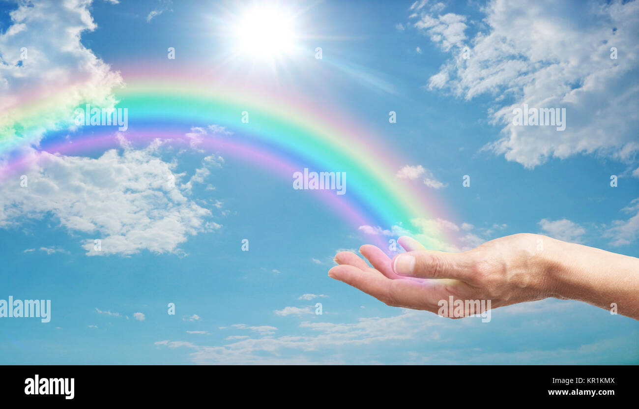 Hand rainbow hi-res stock photography and images - Alamy