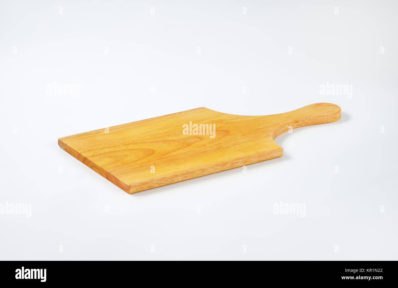 Wooden paddle cutting board Stock Photo - Alamy