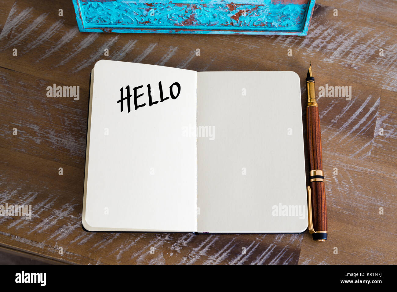Greeting Hello handwritten on notebook Stock Photo - Alamy
