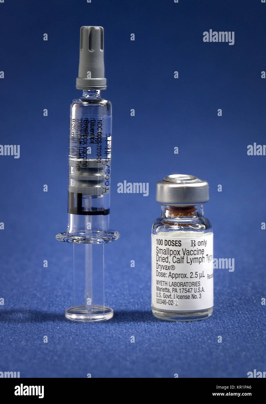 The smallpox vaccine diluent in a syringe along side a vial of Dryvax{R ...