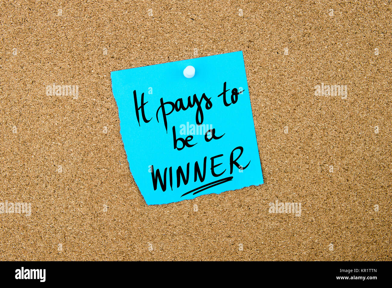 It Pays To Be A Winner written on blue paper note Stock Photo - Alamy