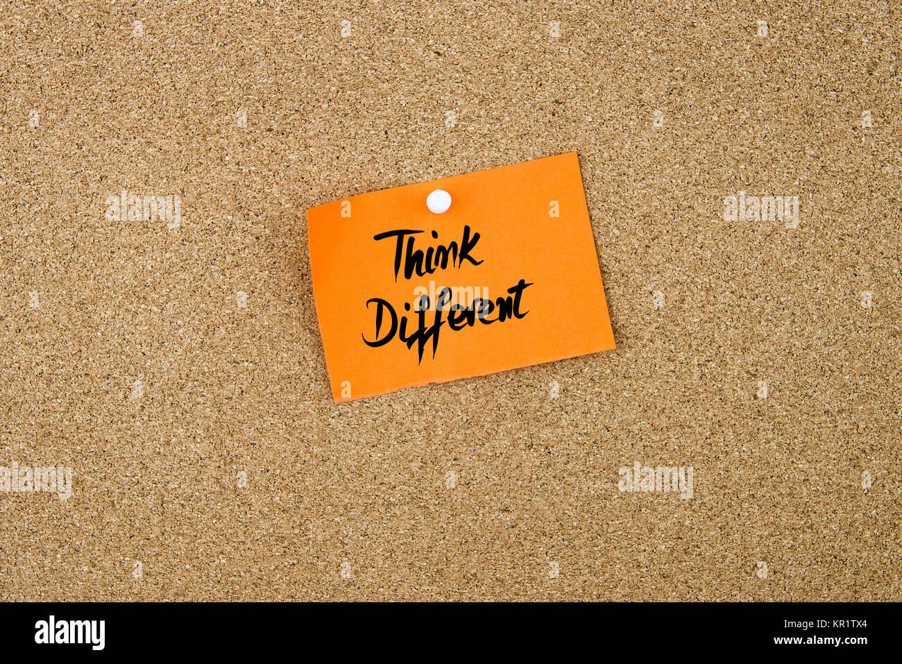 Think Different written on orange paper note Stock Photo - Alamy