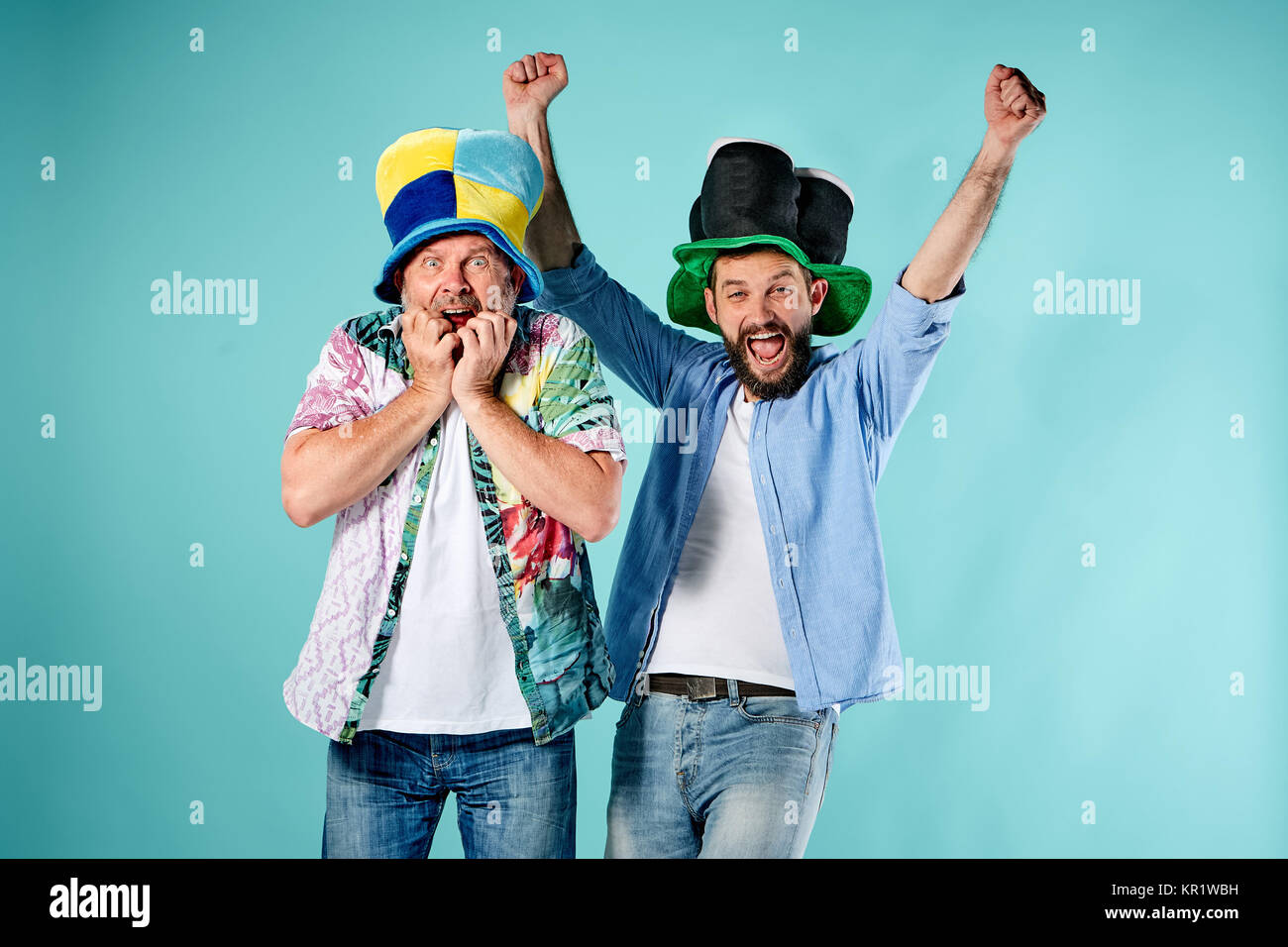 The two football fans over blue Stock Photo - Alamy