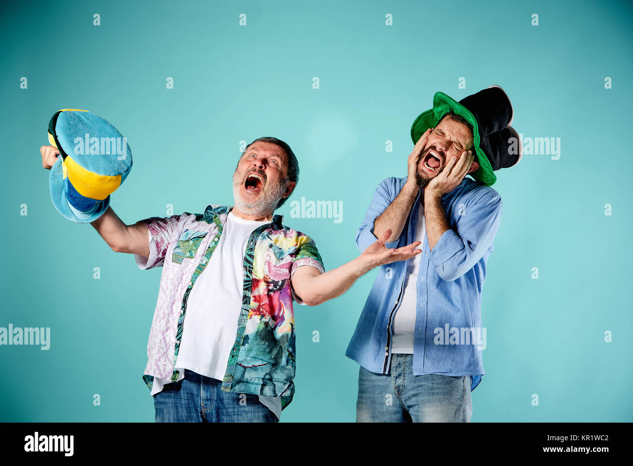 The two football fans over blue Stock Photo - Alamy