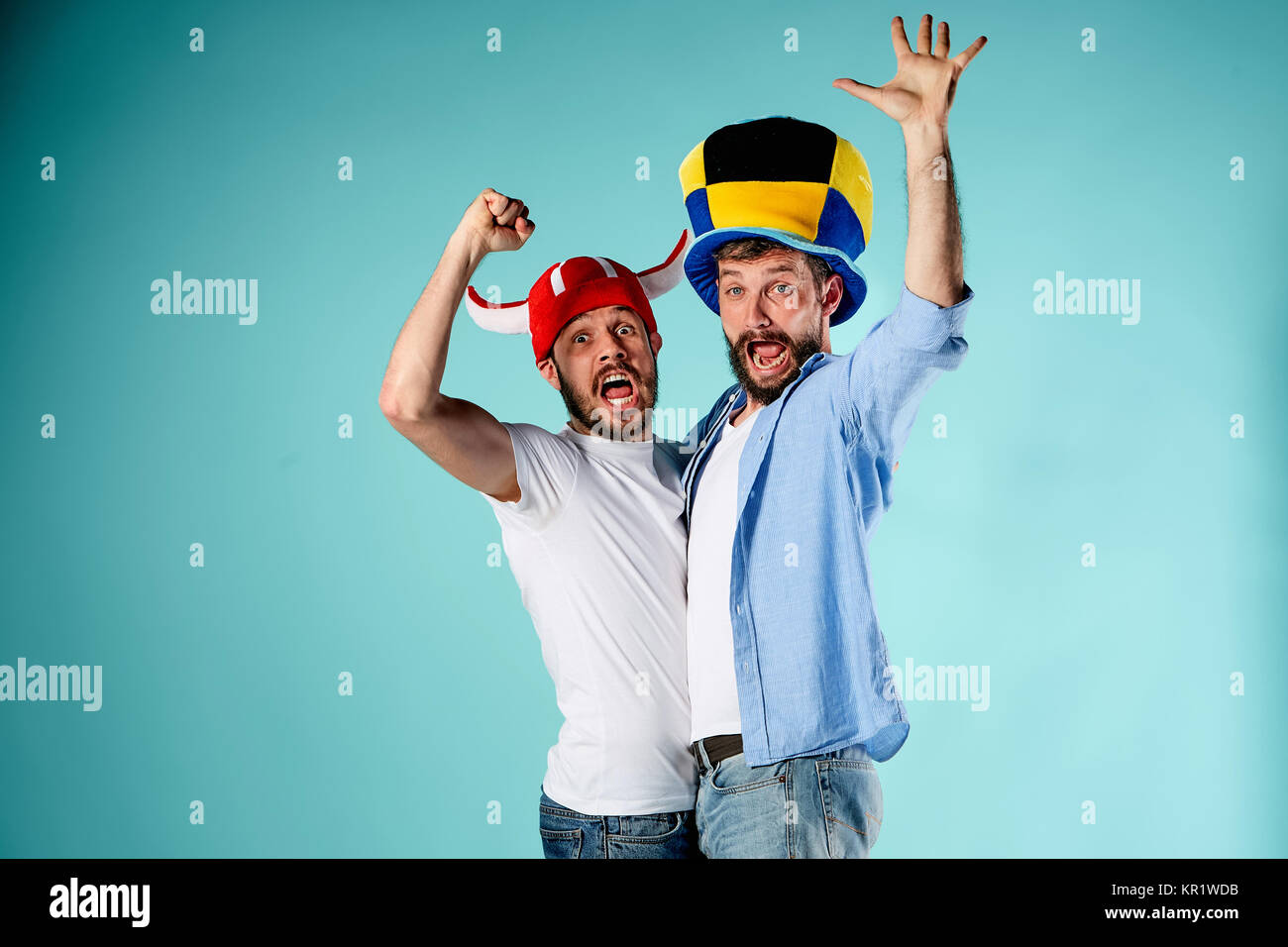 The two football fans over blue Stock Photo - Alamy