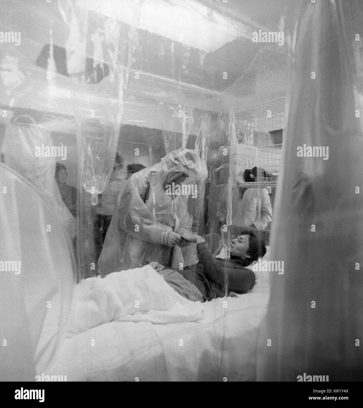 A photograph of a patient in a Vickers Isolation Unit, 1981. Pictured ...