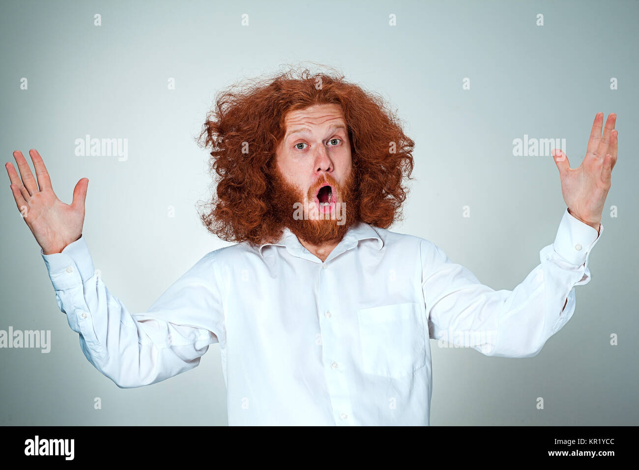 Portrait of young man with shocked facial expression Stock Photo - Alamy