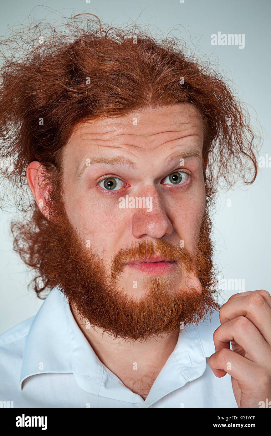 Portrait of young man with shocked facial expression Stock Photo - Alamy
