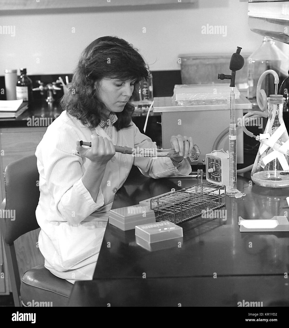 This photograph shows a CDC laboratorian conducting an investigative ...