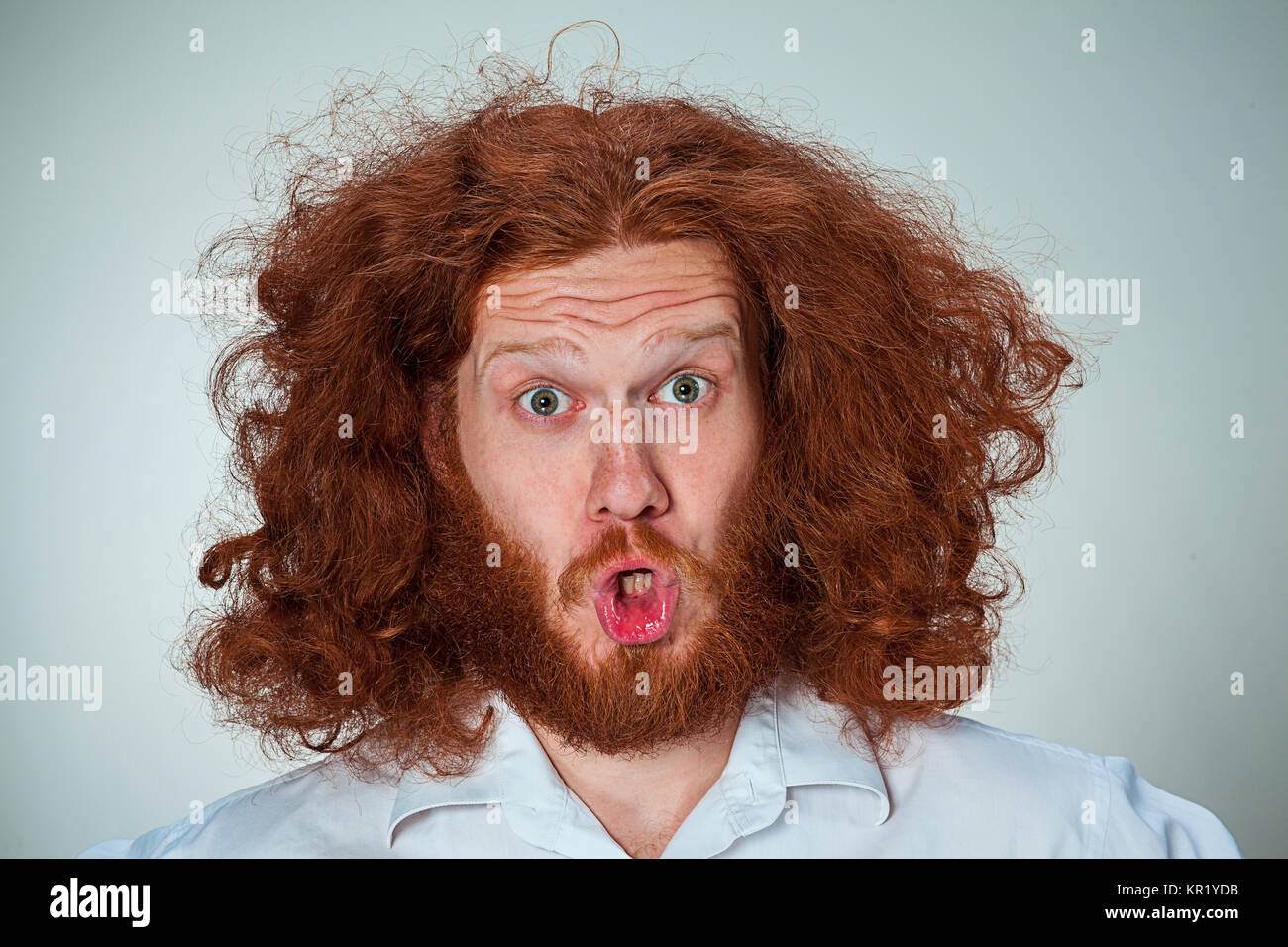 Portrait of young man with shocked facial expression Stock Photo - Alamy