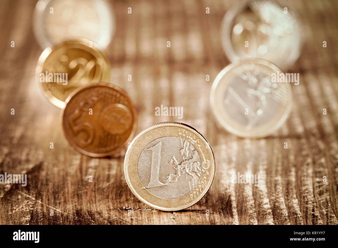 Different euro coins on wooden background Stock Photo - Alamy
