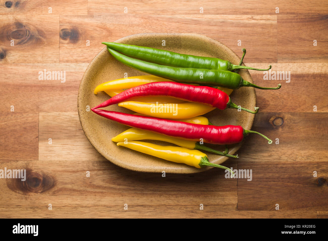 Different colors chilli peppers Stock Photo - Alamy