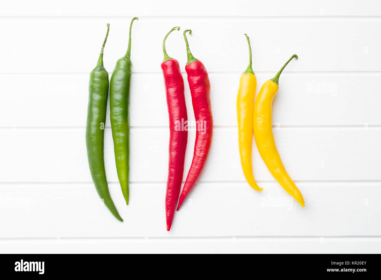Different colors chili peppers Stock Photo - Alamy