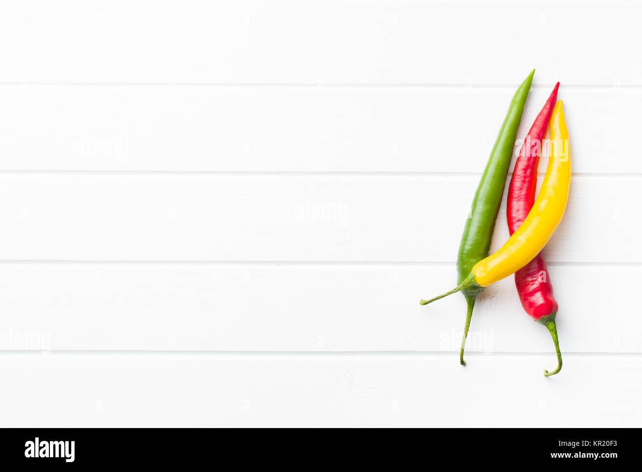 Different colors chili peppers Stock Photo - Alamy
