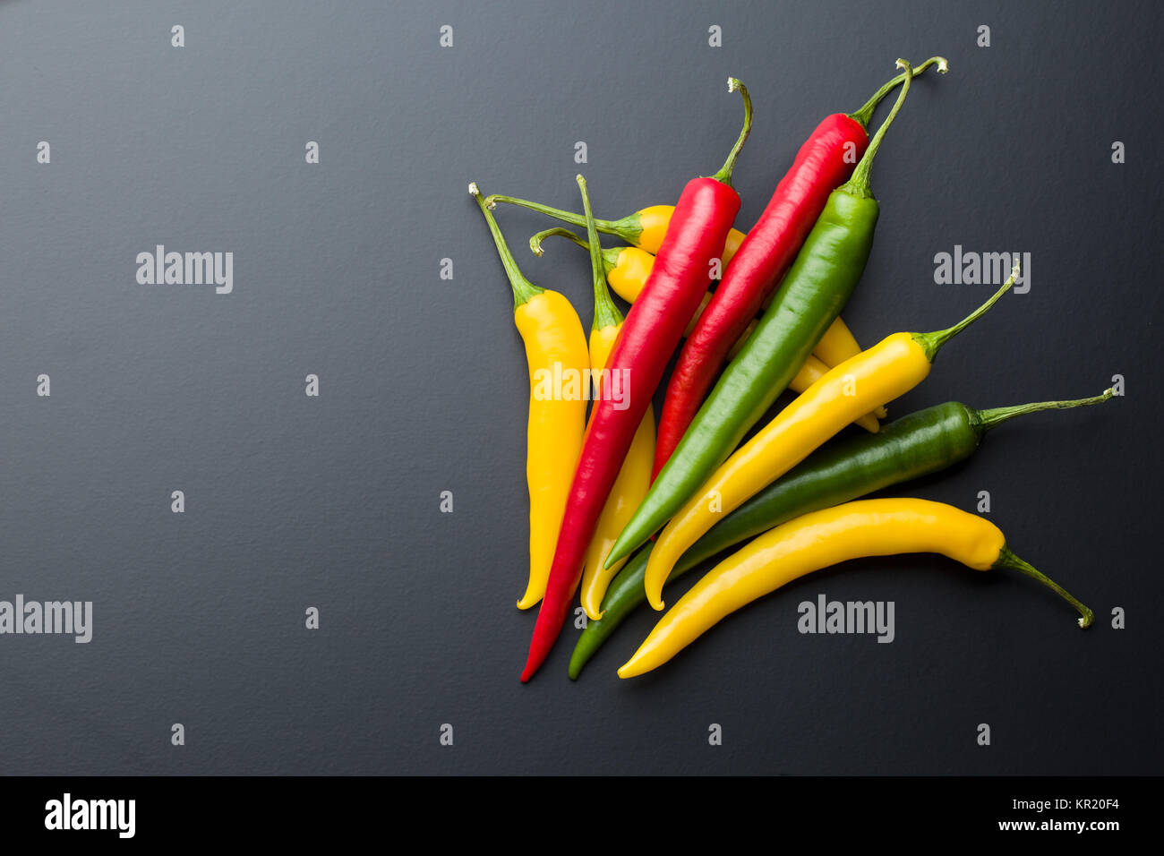 Different colors chili peppers Stock Photo - Alamy