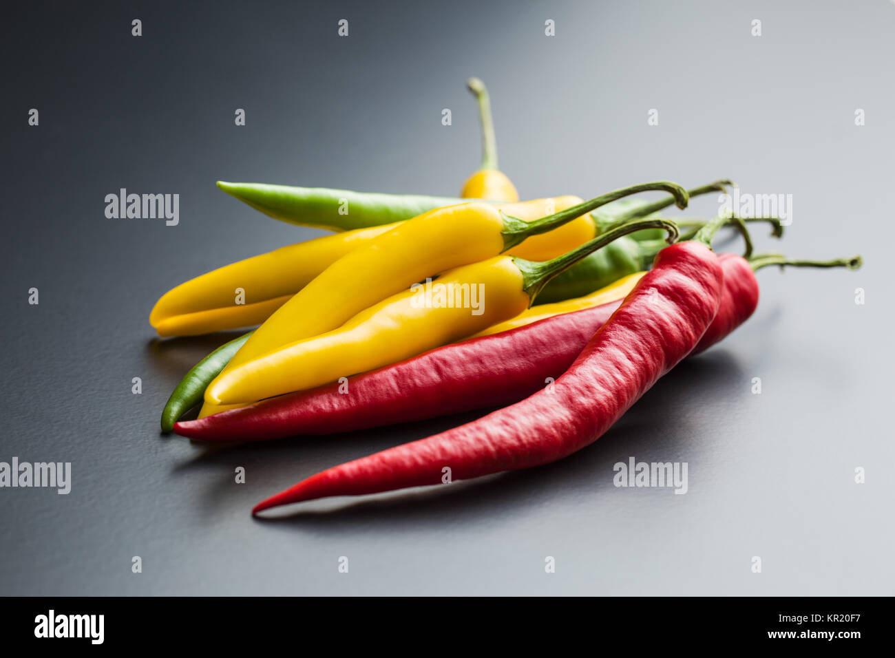 Different colors chili peppers Stock Photo - Alamy