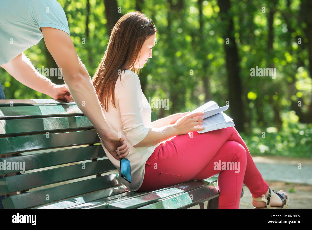 Man Stealing Mobile Phone Stock Photo - Alamy