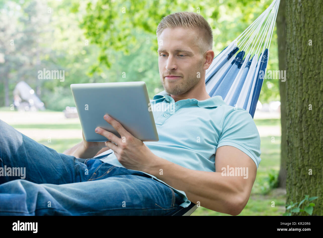 Man Using Digital Tablet Stock Photo - Alamy