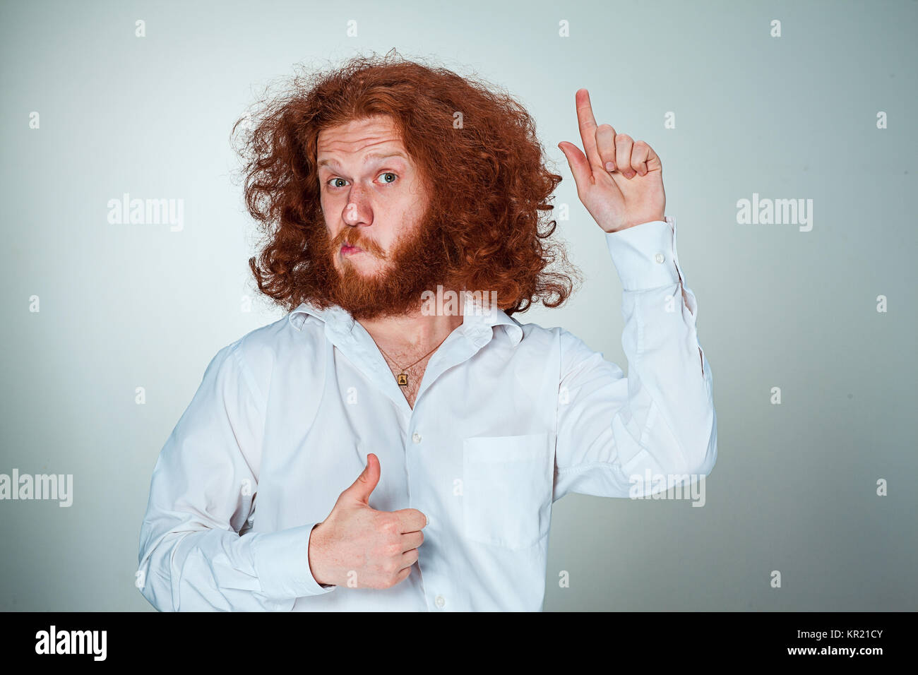 Portrait of young man with shocked facial expression Stock Photo - Alamy