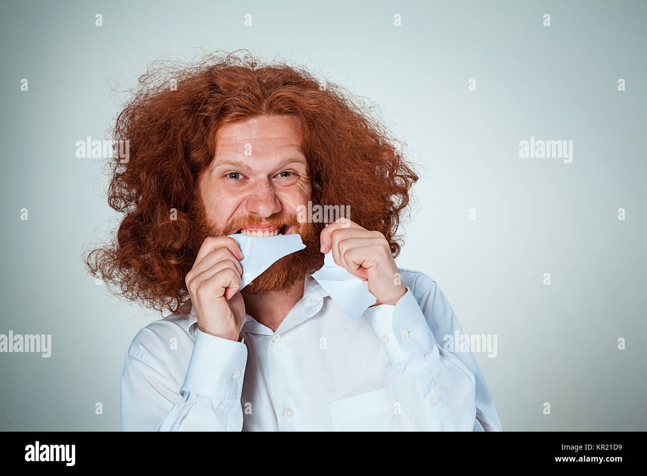 Angry man tear out paper Stock Photo - Alamy