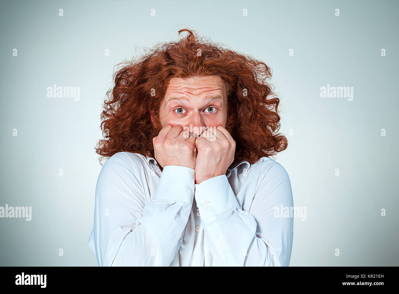 The young frightened man looking at camera Stock Photo - Alamy