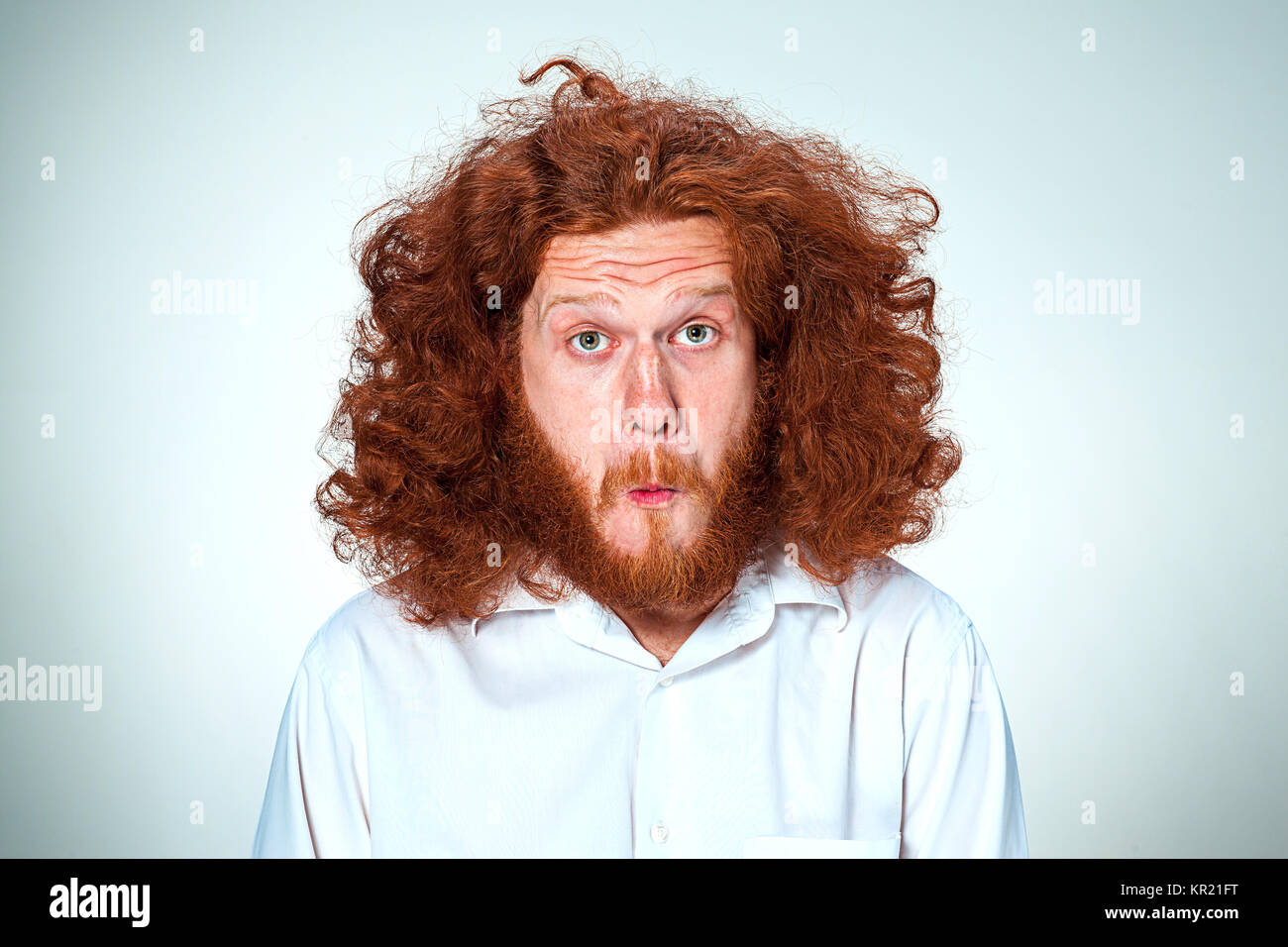 Portrait of young man with shocked facial expression Stock Photo - Alamy