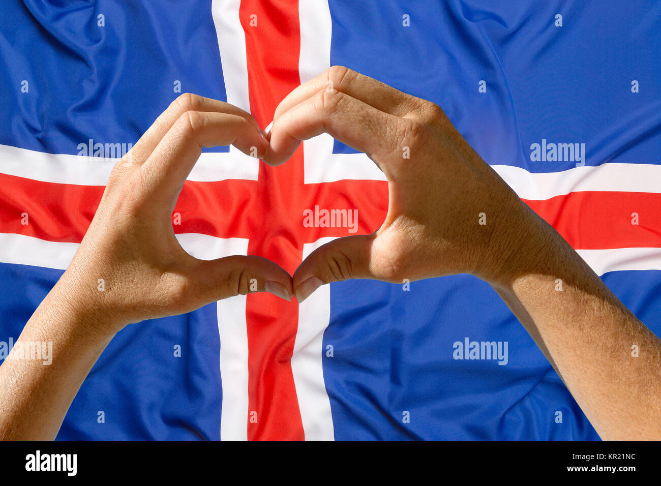 Female hands heart symbol with Iceland flag in background Stock Photo ...