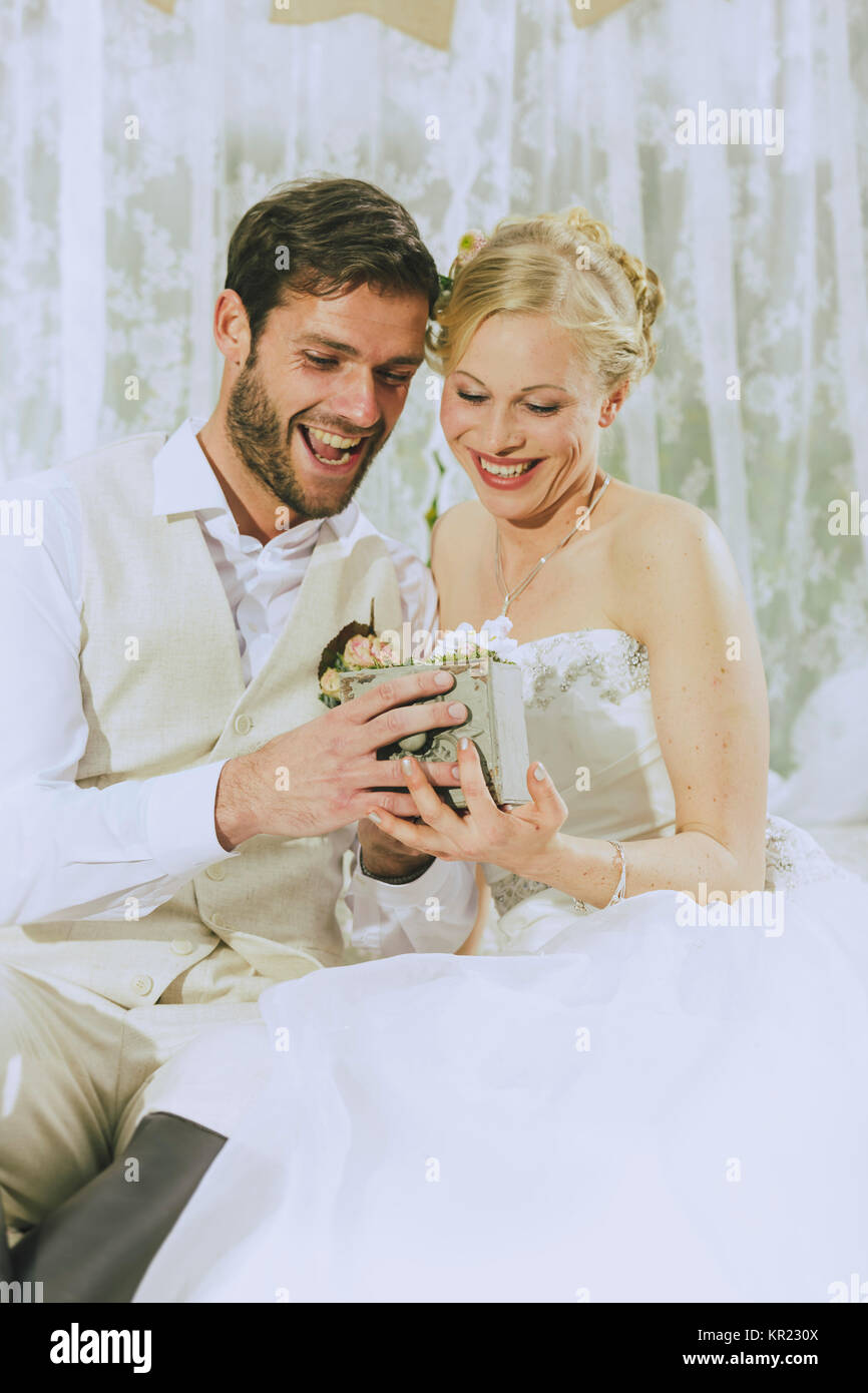 bride and groom see full joy of their wedding rings on and laugh Stock ...