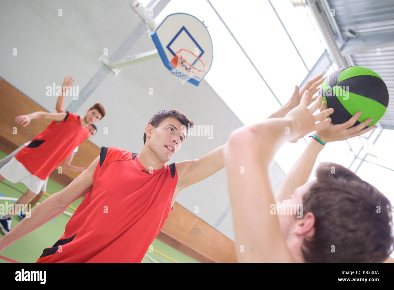Young men playing basket ball Stock Photo - Alamy