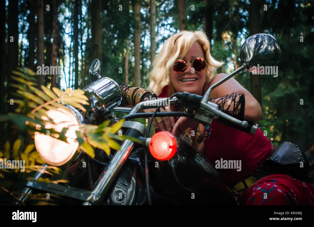 Mature woman sitting on motorcycle hi-res stock photography and images ...