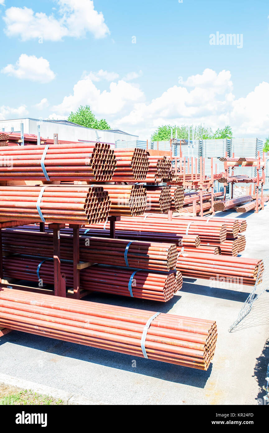 Steel Pipes bunch on the rack in warehouse Stock Photo - Alamy