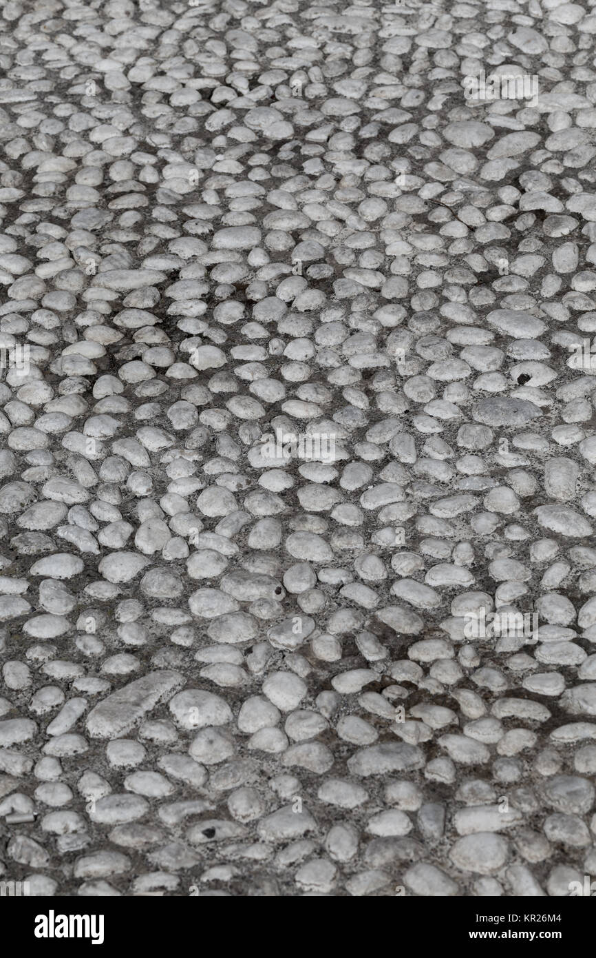 Round stones in the ground Stock Photo - Alamy