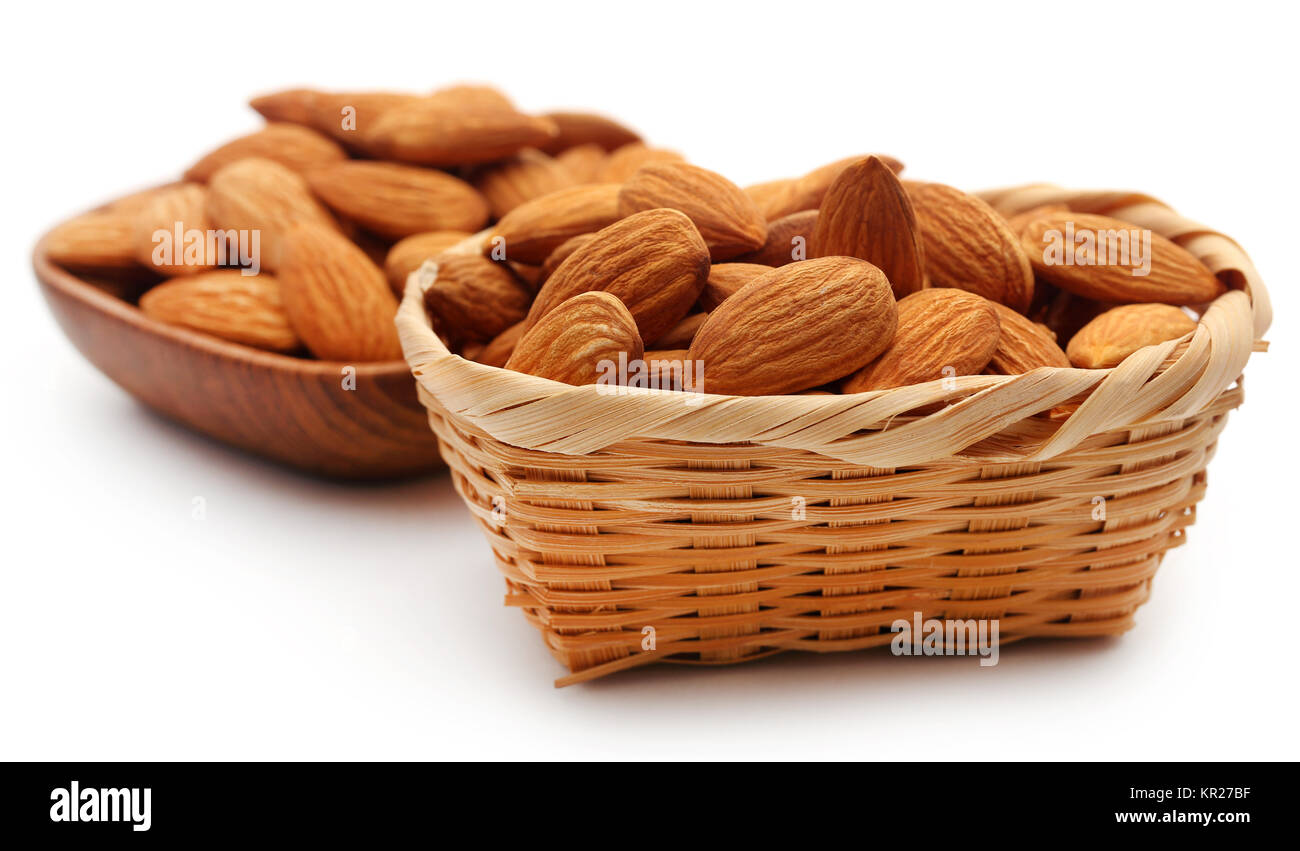Organic almonds over white background Stock Photo - Alamy